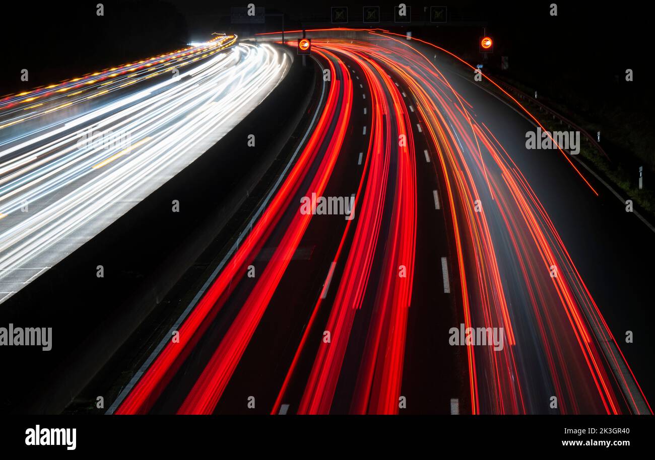 27 September 2022, Hessen, Frankfurt/Main: Passing cars trace their ...