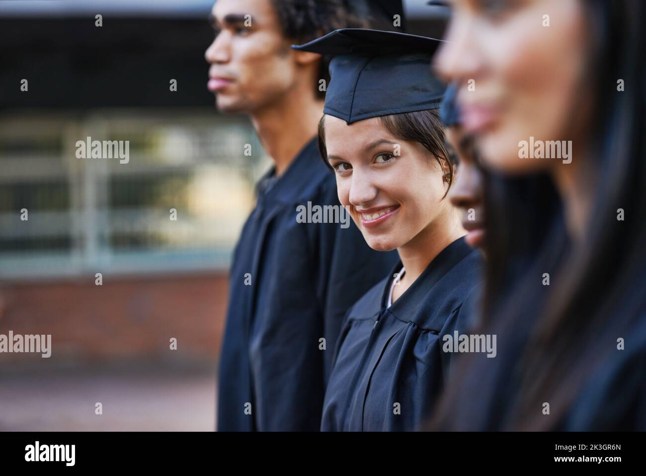 I made it to graduation. A college graduate smiling during her ...