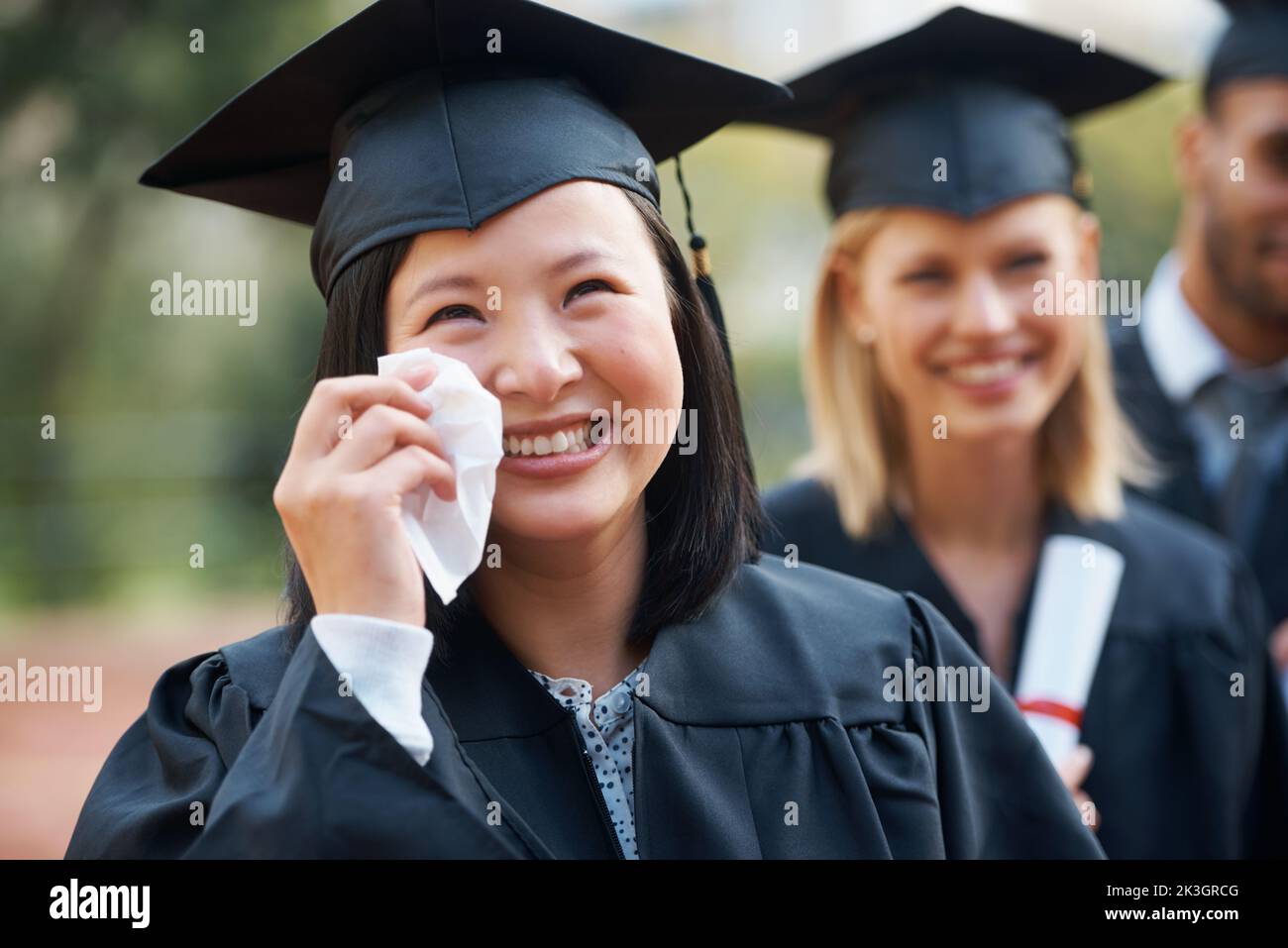 Filled with a sense of accomplishment. An ecstatic young graduate ...