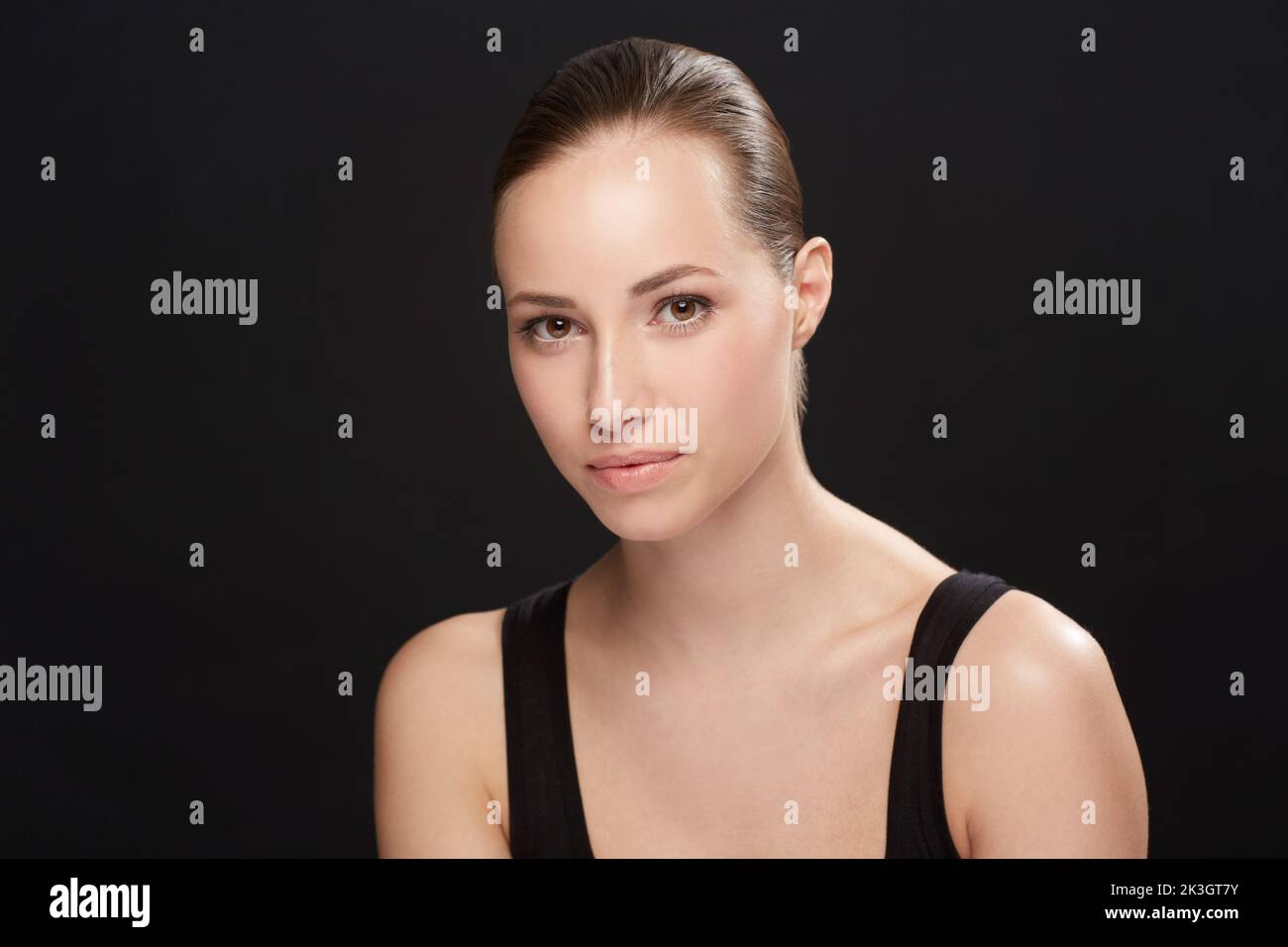 Classical Beauty. A naturally beautiful young woman isolated against a ...