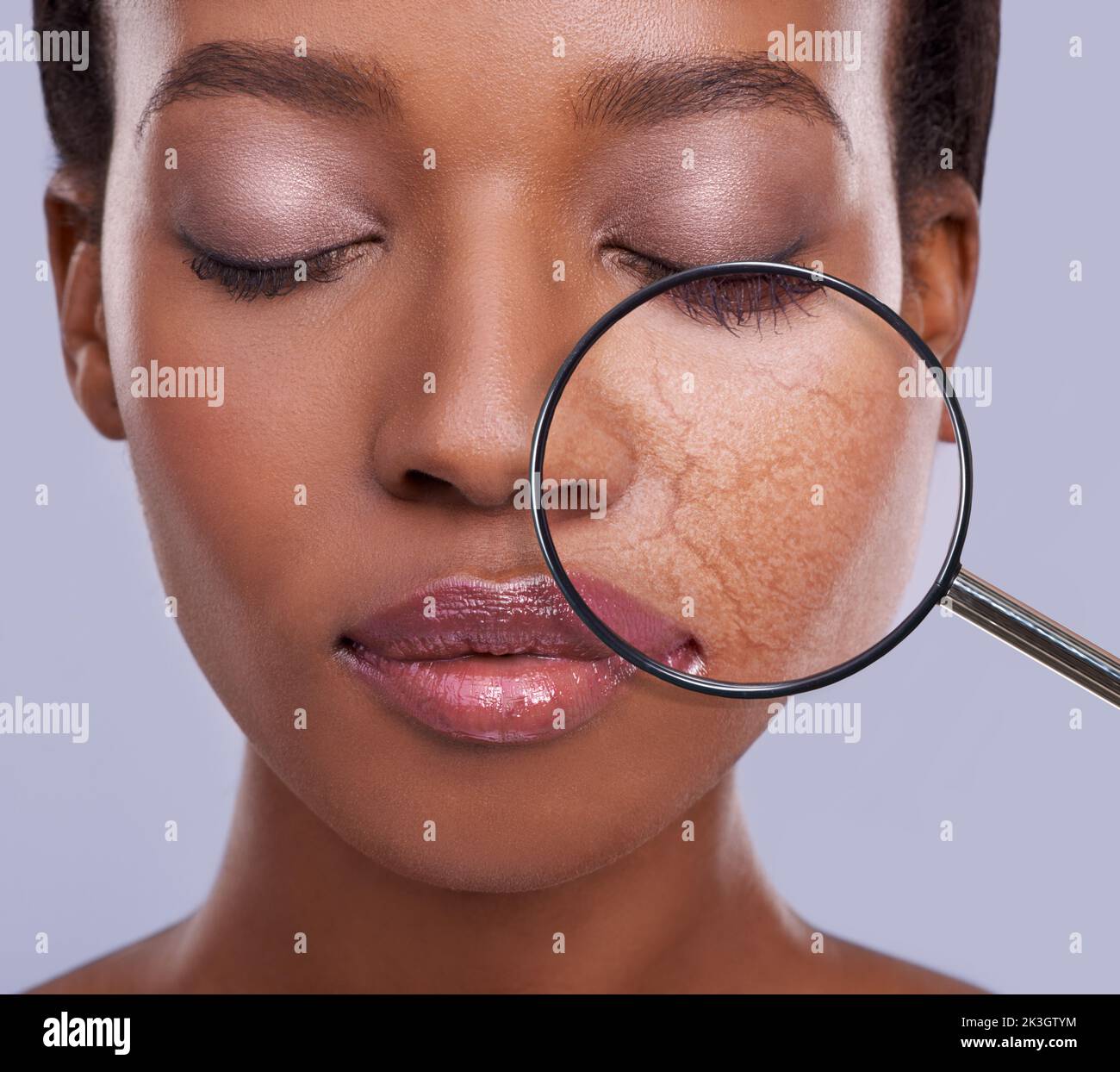 The face of skin care. a beautiful african woman against a purple ...