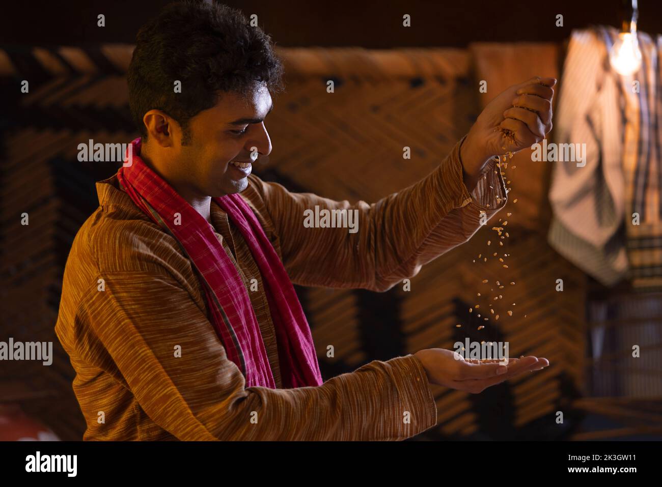 Hand pouring rice hi-res stock photography and images - Alamy