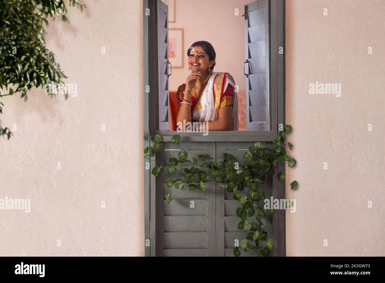 Indian woman looking outside window hi-res stock photography and images ...