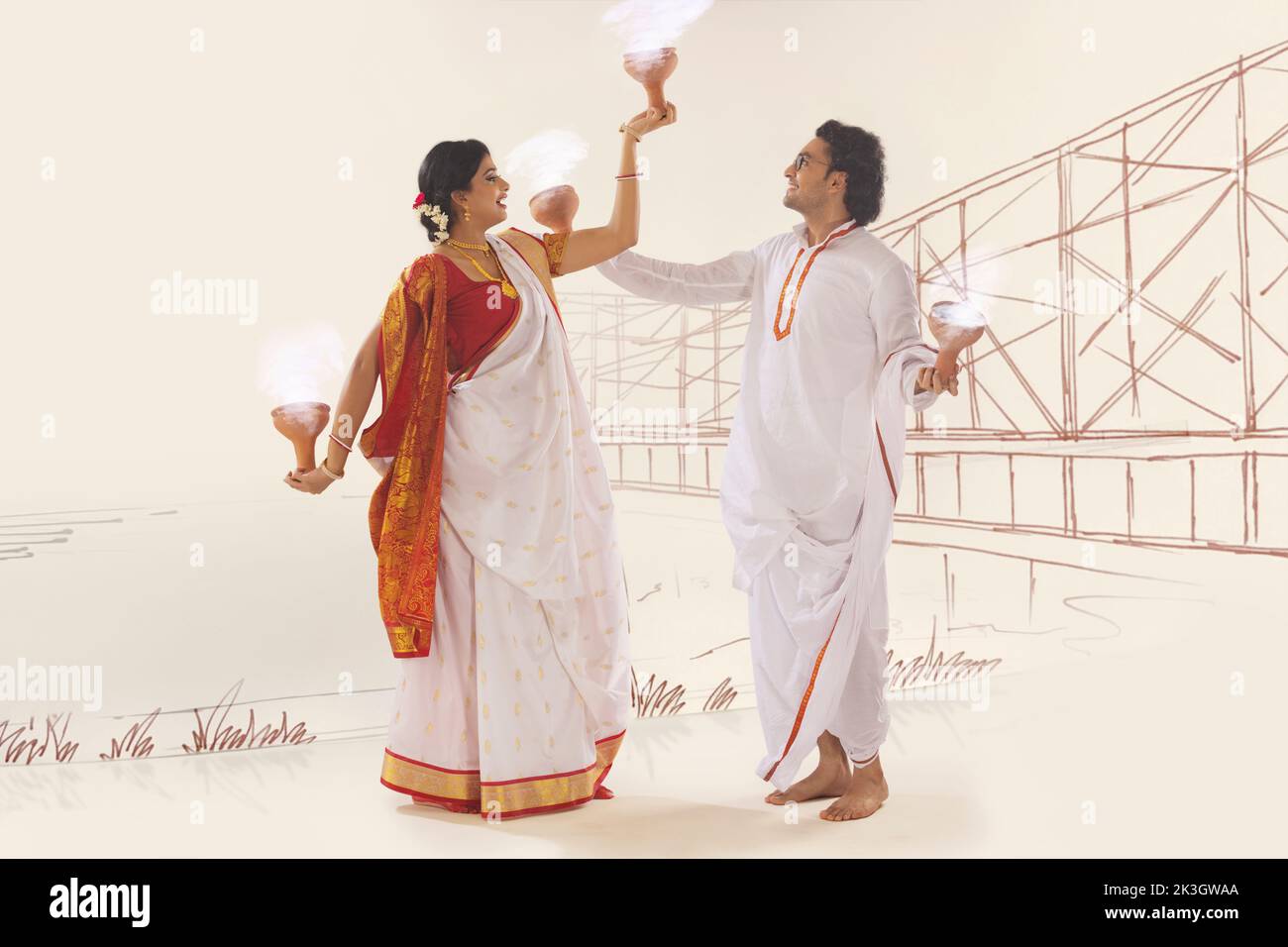 Bengali couple performing dhunuchi dance on the occasion of Durga Puja ...