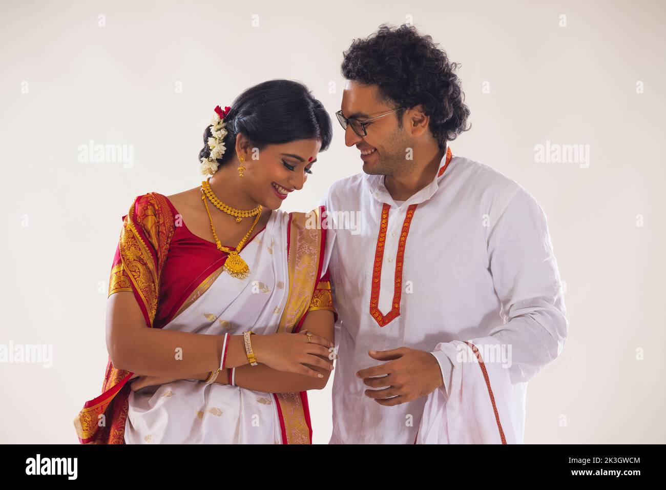 Portrait of smiling Bengali couple against white background Stock Photo ...