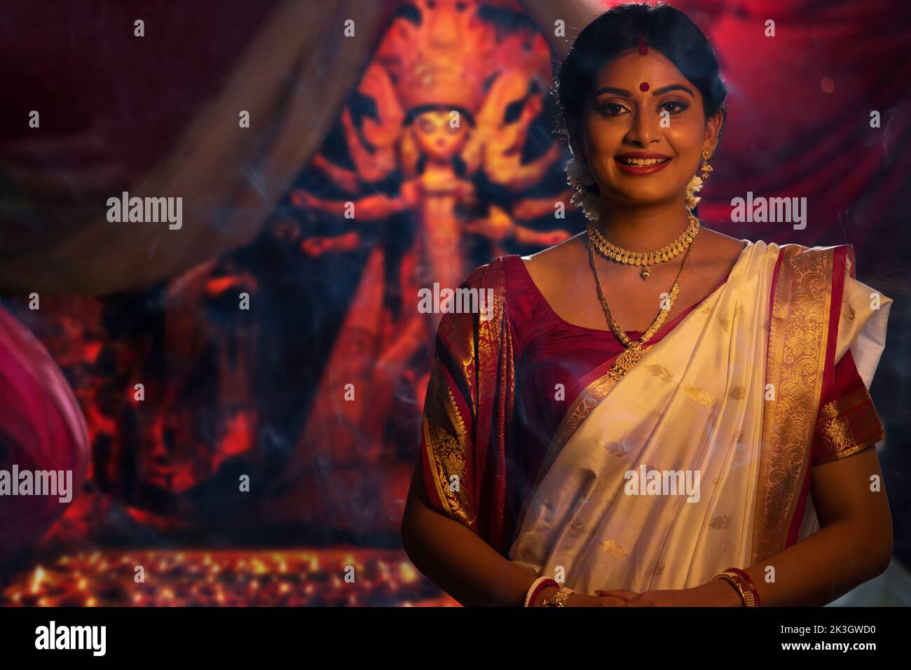 Portrait of young Bengali woman in traditional outfit on the occasion of Durga Puja Stock Photo ...