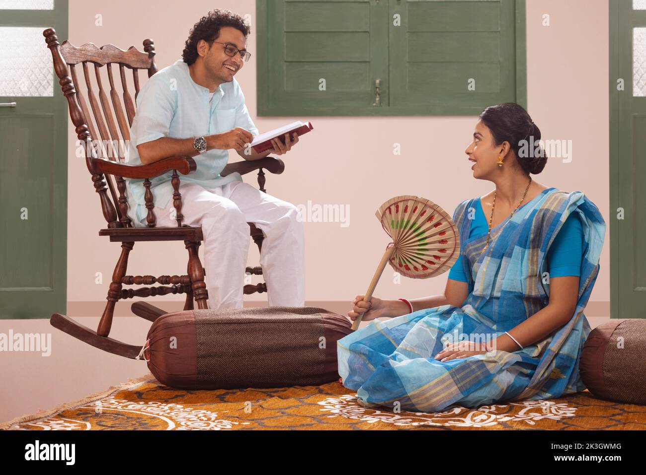 Bengali couple sitting together in living room at home Stock Photo - Alamy
