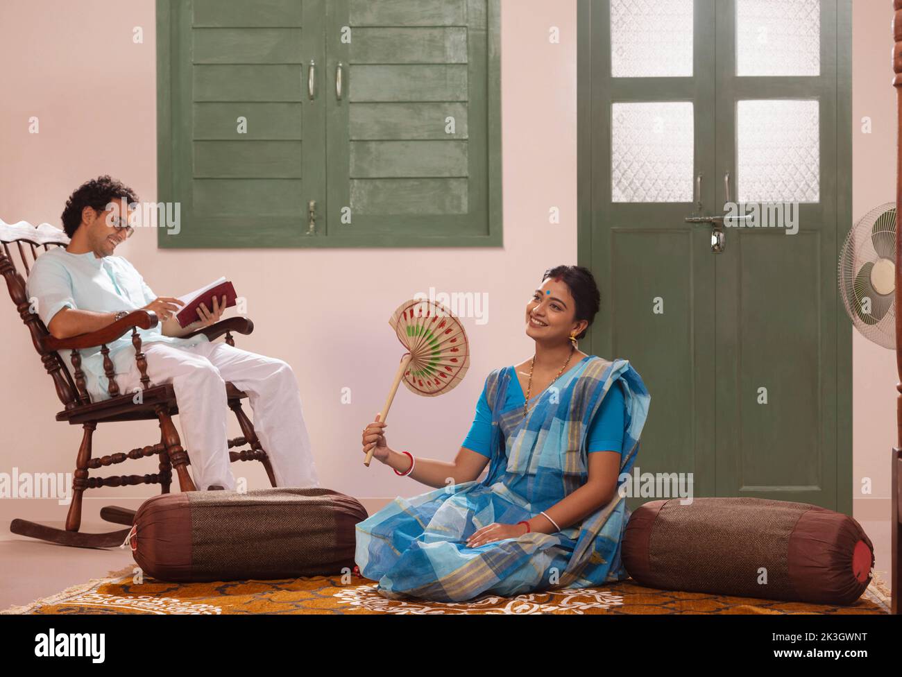 Bengali couple sitting together in living room at home Stock Photo - Alamy