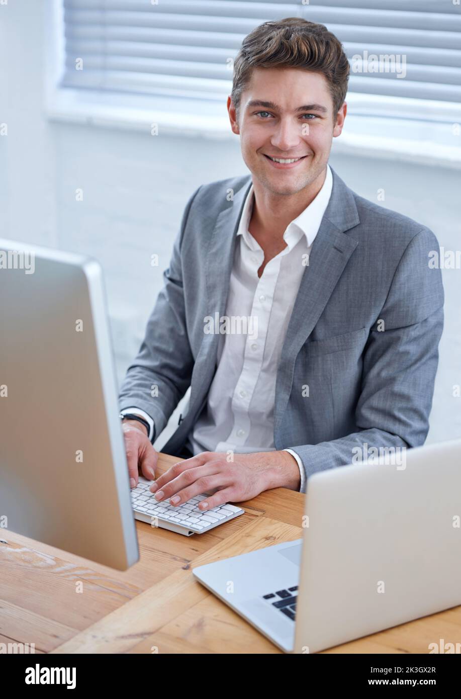 Hes young and ambitious. A handsome young executive working in his ...