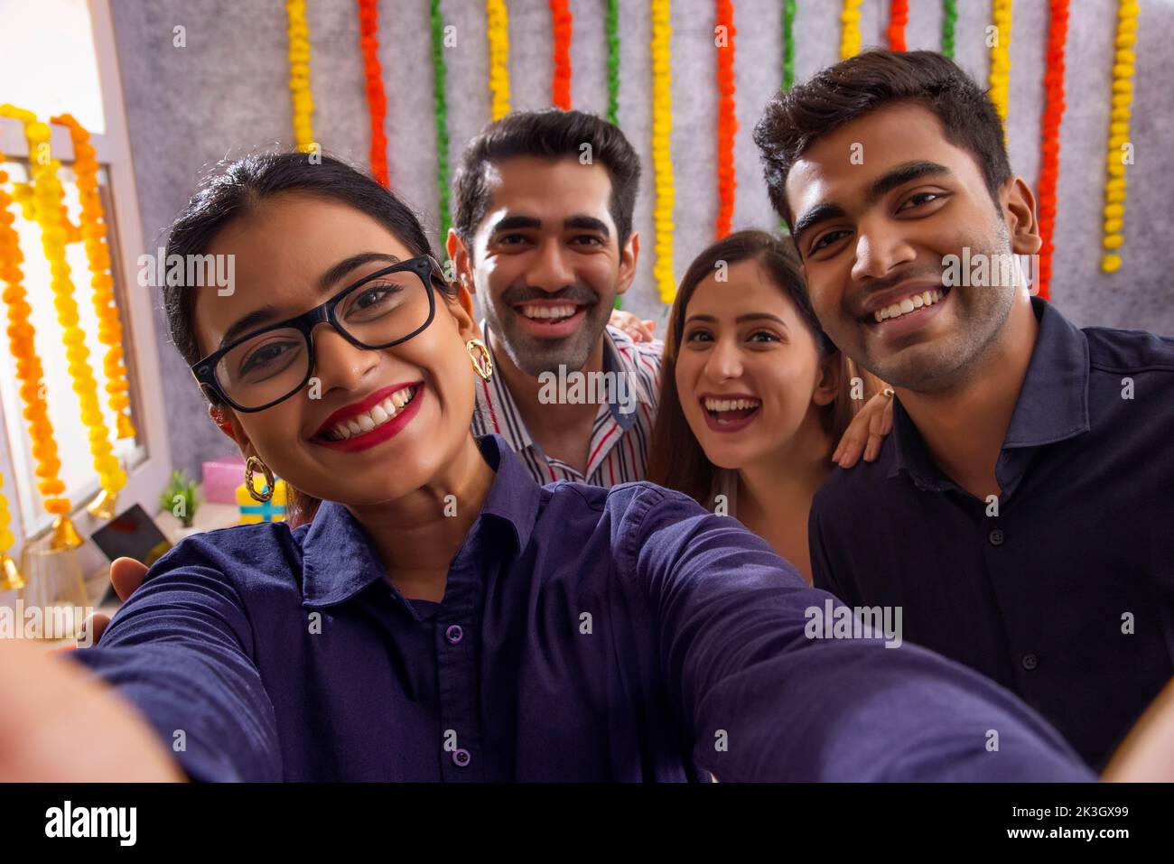 Employees taking selfie in office during Diwali celebration Stock Photo ...