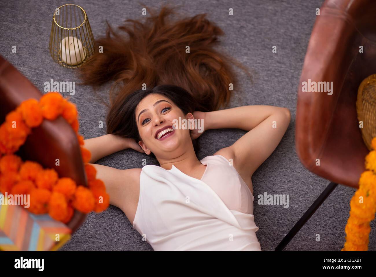 Top angle view of an employee lying on office floor during Diwali ...