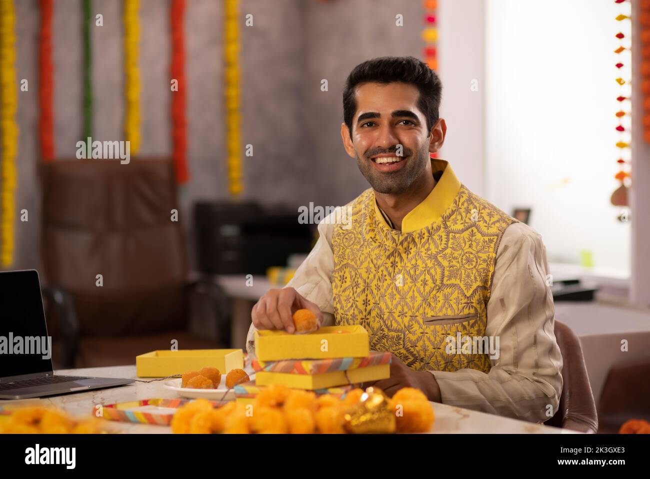 Indian man eating sweet hi-res stock photography and images - Alamy