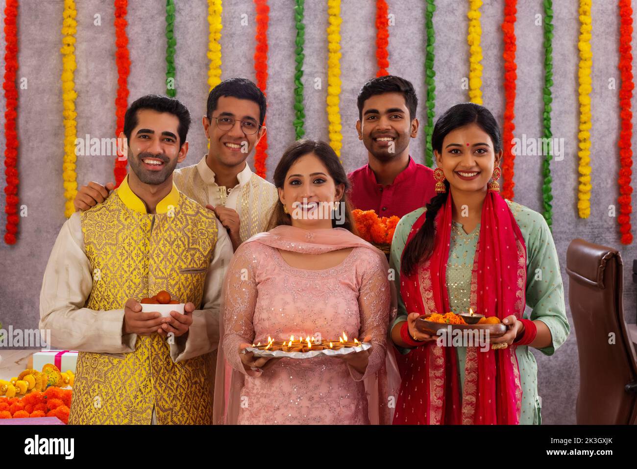 Office colleagues celebrating Diwali together in office Stock Photo - Alamy