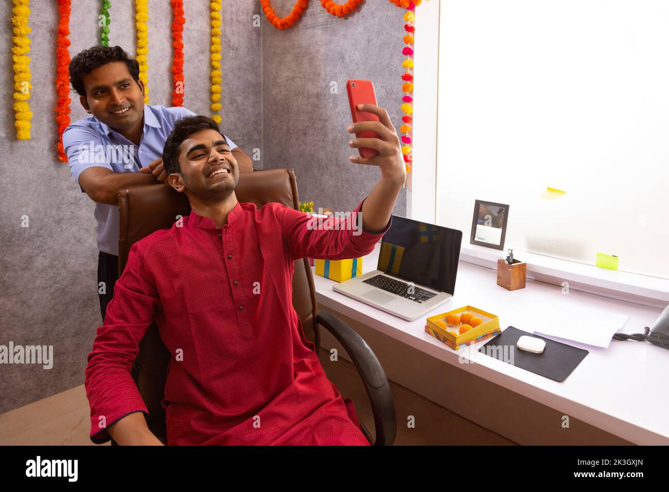 Employee taking selfie on mobile phone during Diwali celebration Stock ...