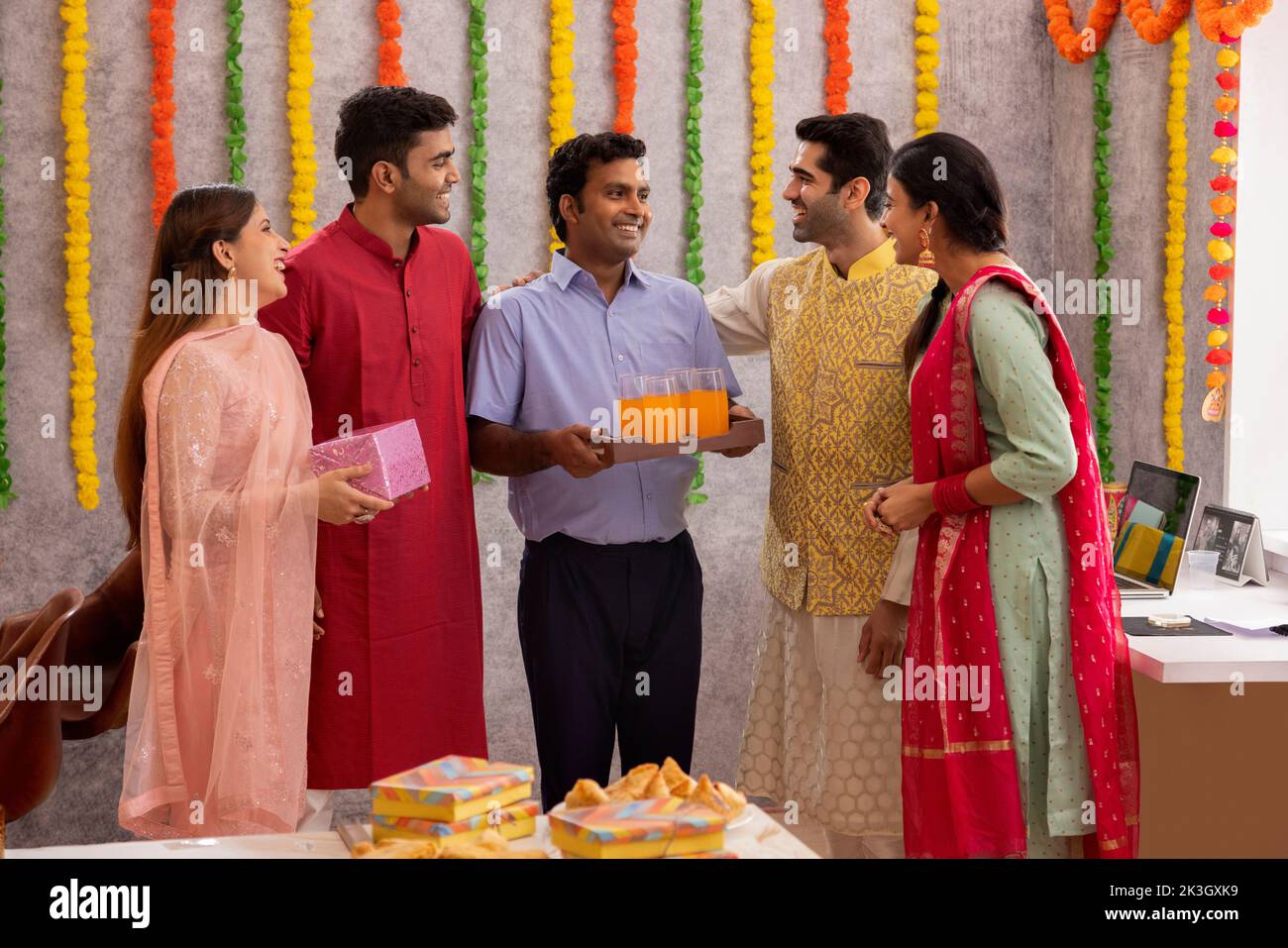 Office colleagues celebrating Diwali together in office Stock Photo - Alamy