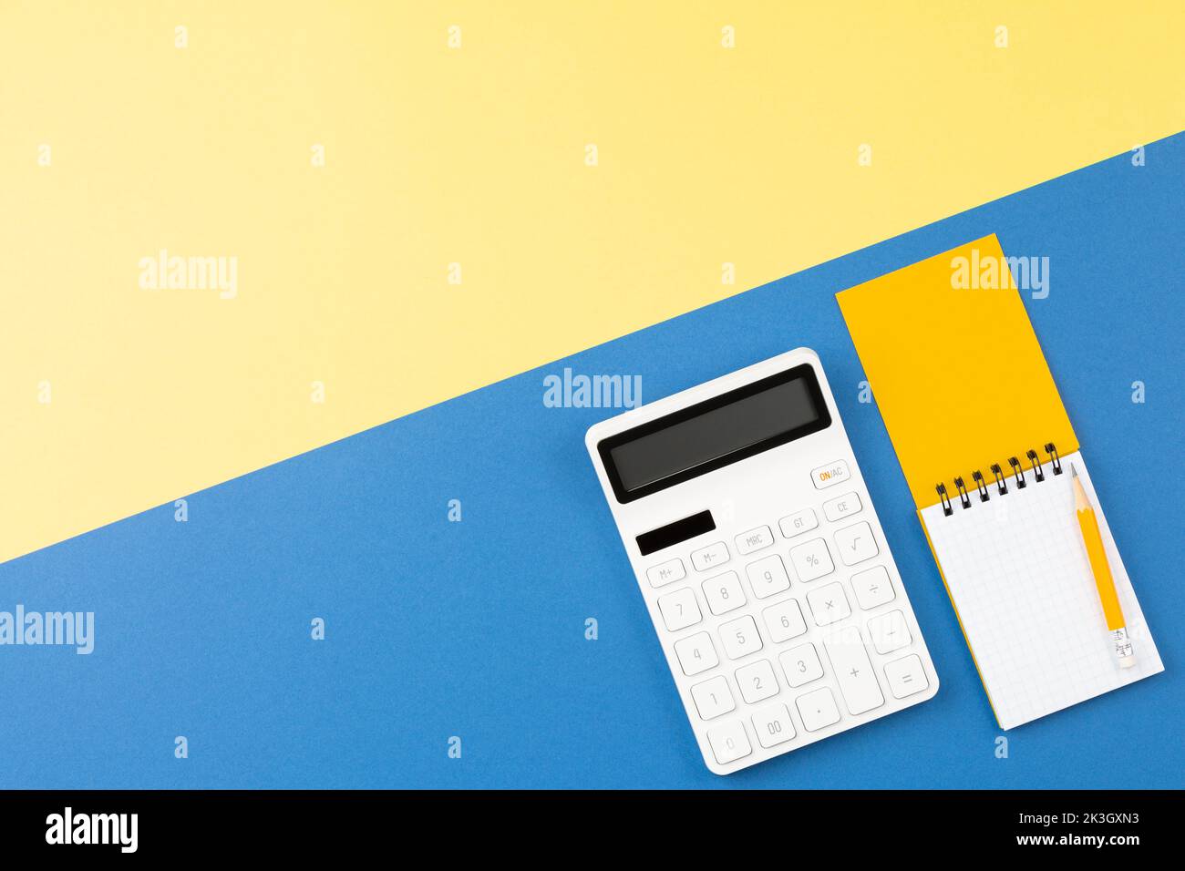 Notepad with stationery on office desk Stock Photo - Alamy