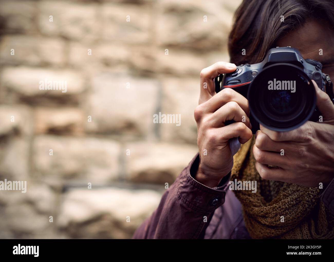 Photography is my passion. a handsome young photographer at work in the ...