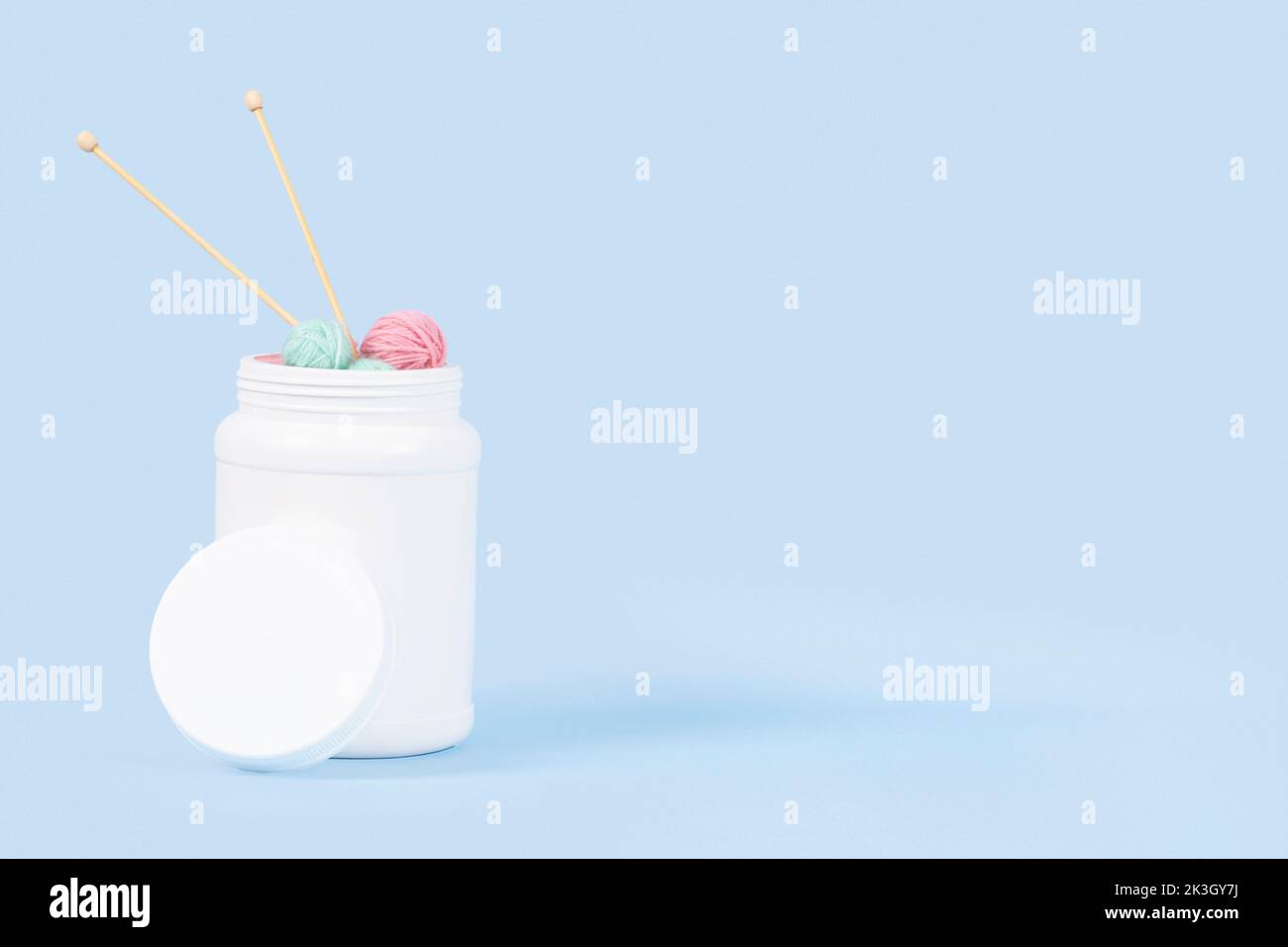 Knitting as therapy. Supplement bottle with thread yarn balls and ...