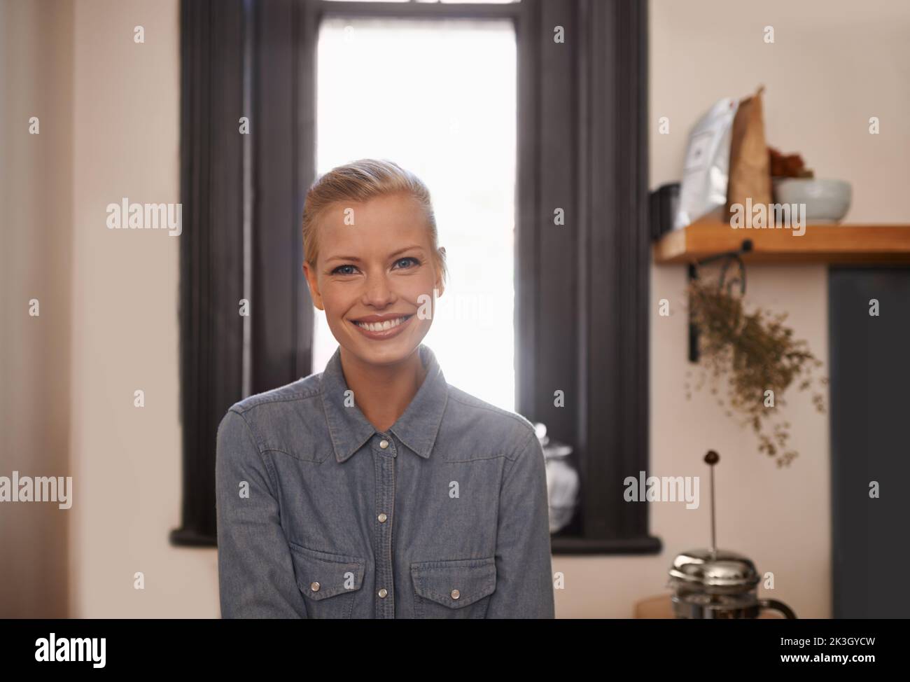 Her first cup in the morning. Portrait of a beautiful young woman ...