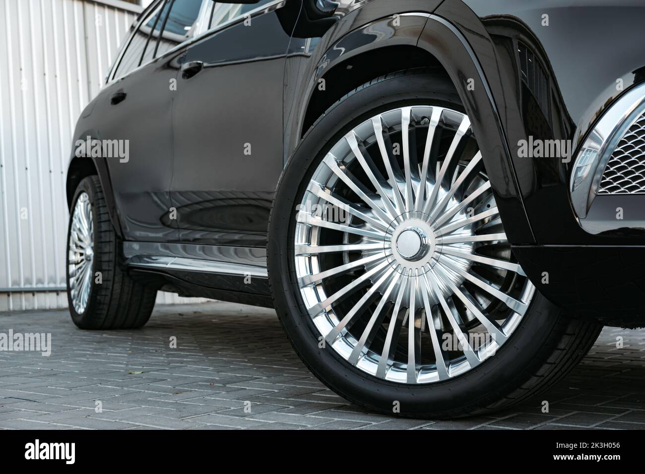 Aluminium rim of luxury black suv car wheel close up Stock Photo - Alamy