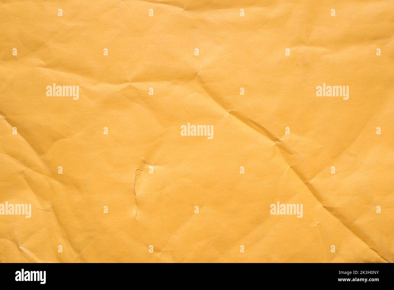 detailed crumpled yellow paper background Stock Photo - Alamy