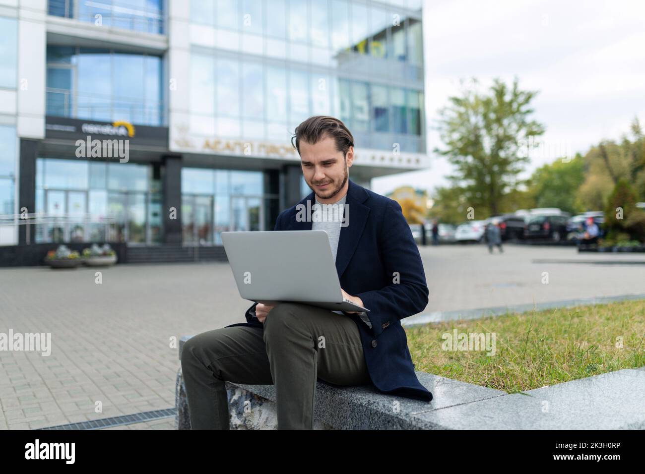businesswoman working on a laptop online on the background of the ...