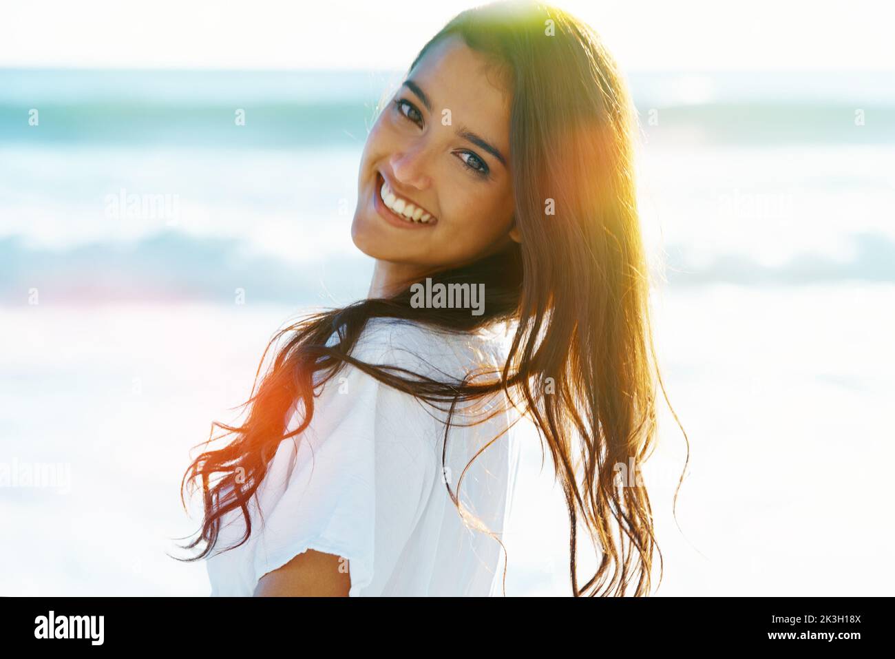 Embracing the spirit of summer. Pretty woman standing outside and ...