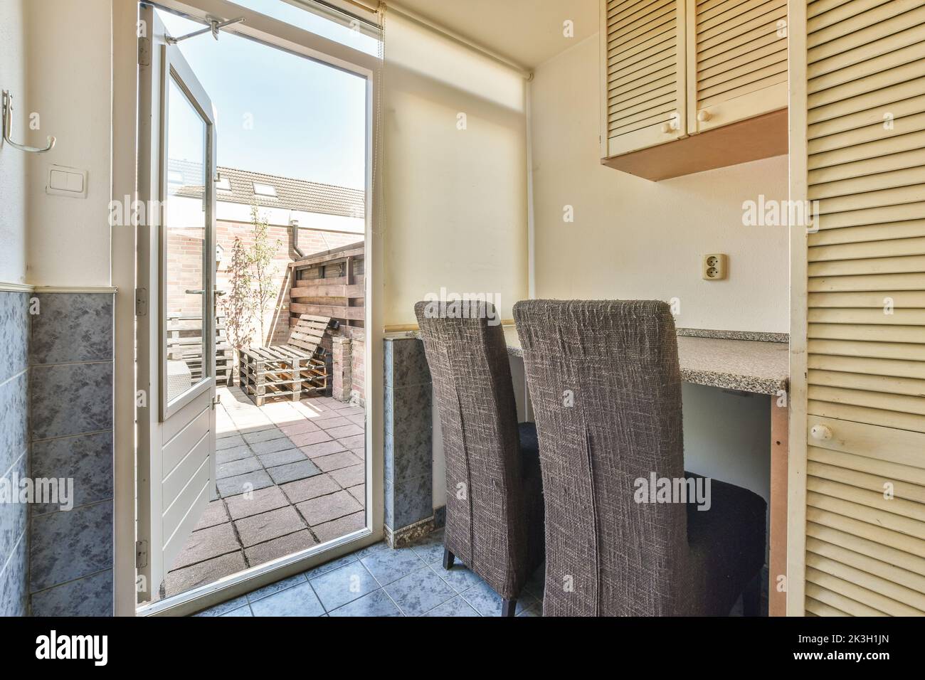 Minimalist interior of study room with tile floor and armchair Stock ...