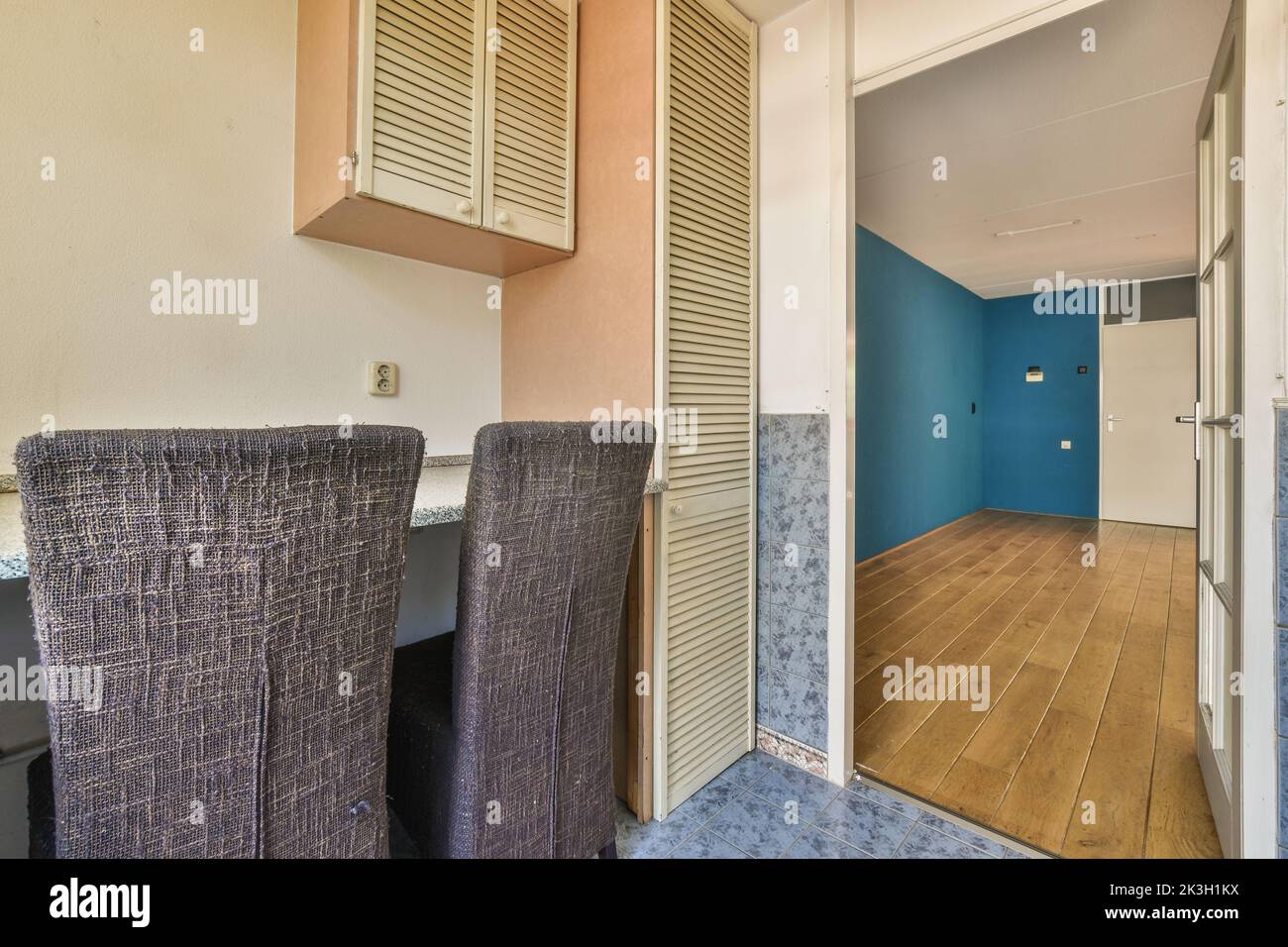 Minimalist interior of study room with tile floor and armchair Stock ...