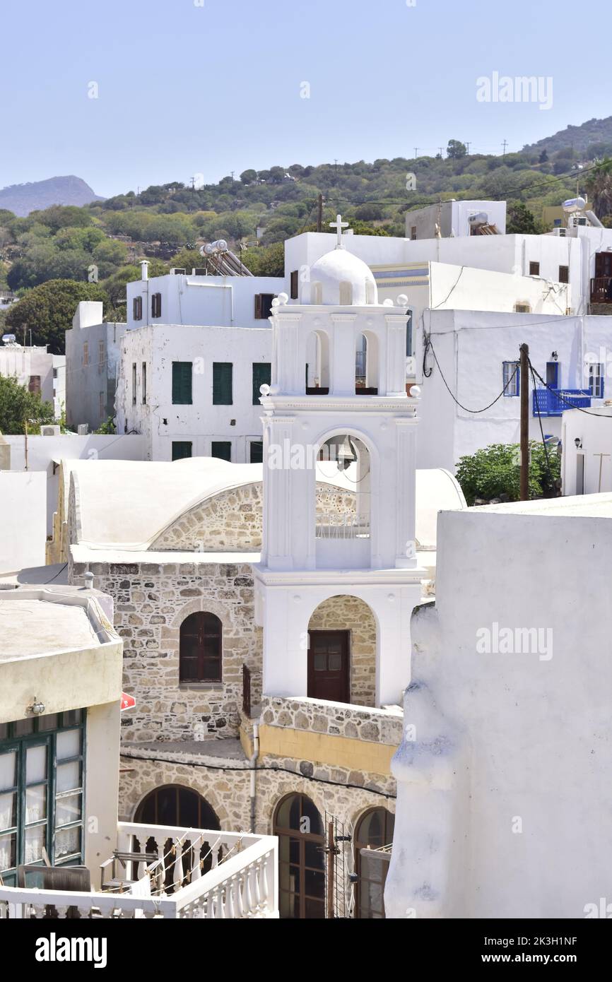 White houses with blue shutters, balconies, the traditional Greek ...