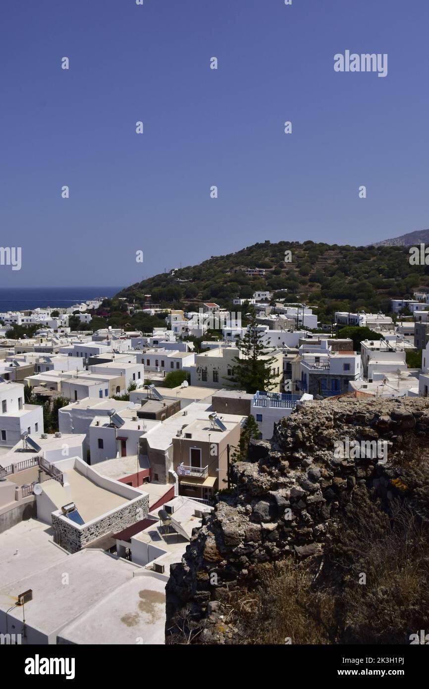 White houses with blue shutters, balconies, the traditional Greek ...