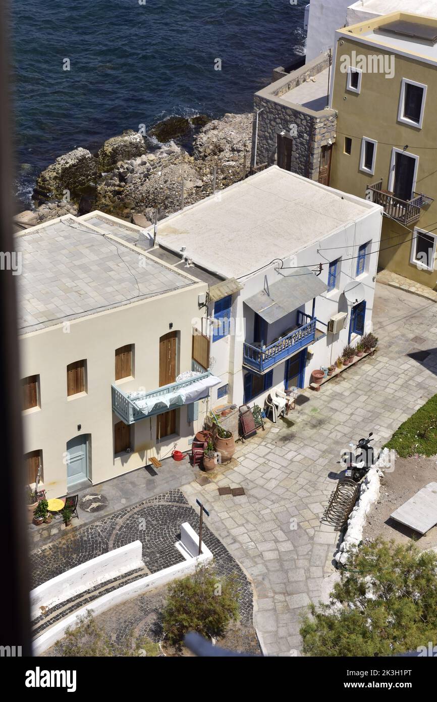 White houses with blue shutters, balconies, the traditional Greek ...