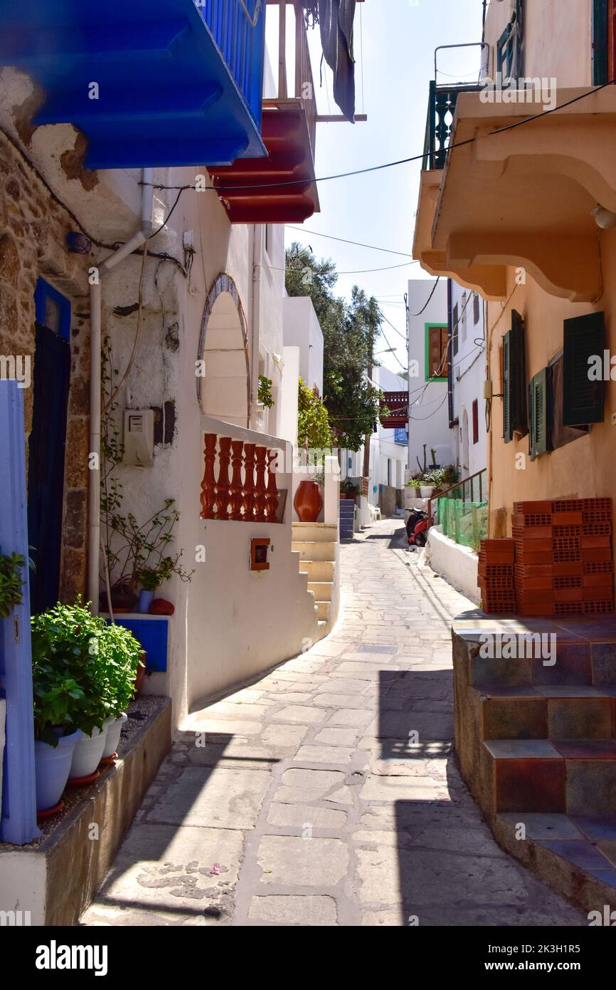 White houses with blue shutters, balconies, the traditional Greek ...