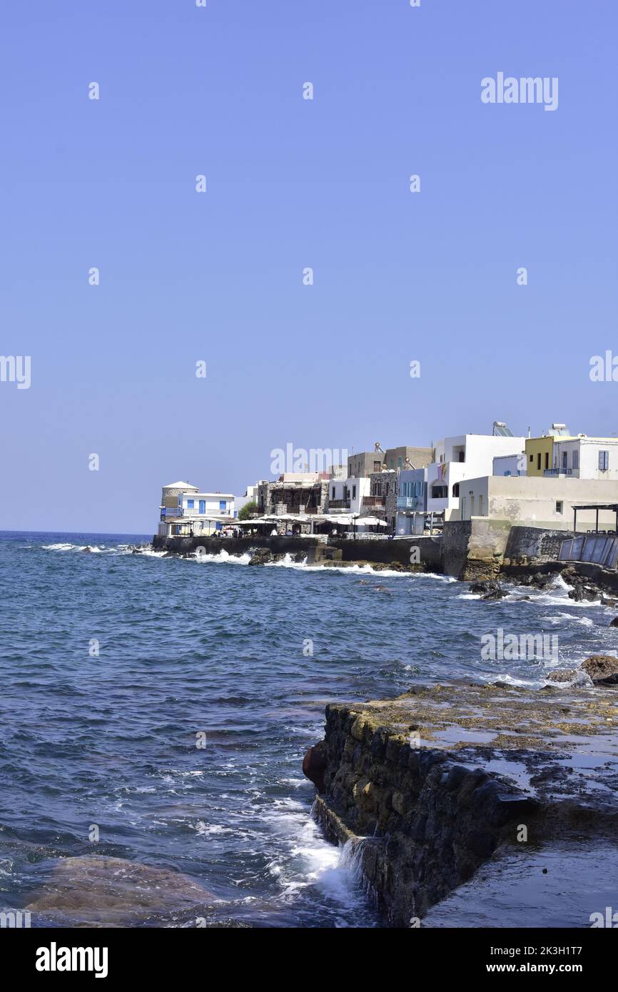 White houses with blue shutters, balconies, the traditional Greek ...