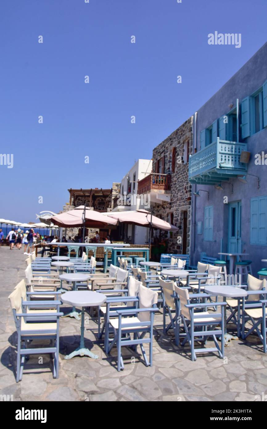 White houses with blue shutters, balconies, the traditional Greek ...