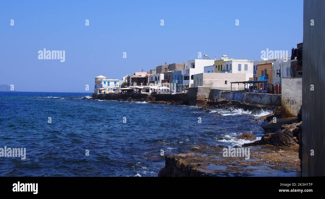 White houses with blue shutters, balconies, the traditional Greek ...