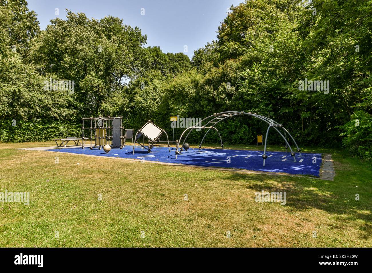 Exterior view of sitting area and playground with swings Stock Photo ...
