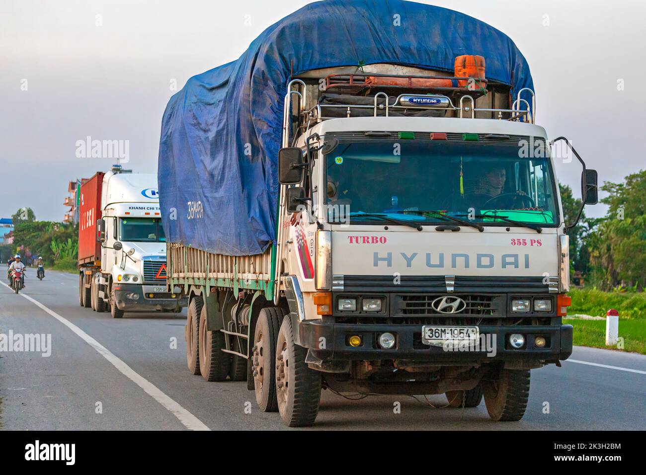 Trucks and traffic on rural. highway, Hai Phong, Vietnam Stock Photo ...