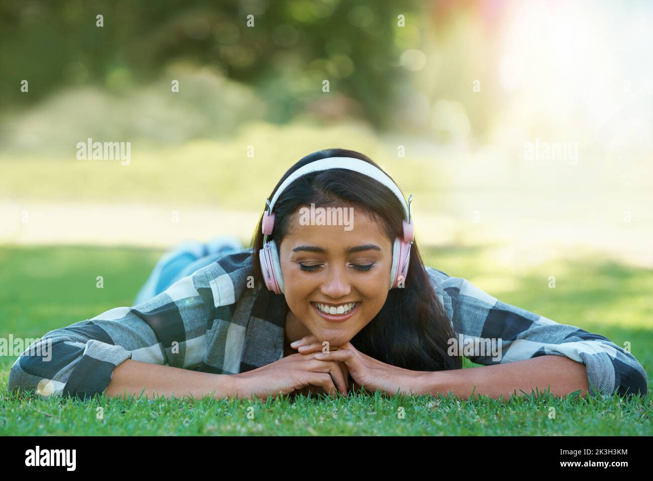 Take the music with you. A young woman listening to music over her ...
