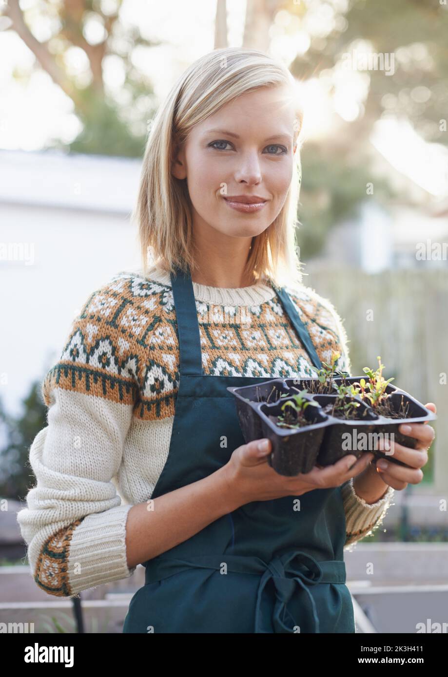 Gardening is healthy hobby. A beautiful young woman busy gardening Stock Photo - Alamy