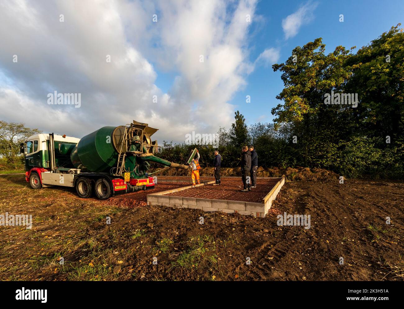 Early morning concrete pouring of a stable block slab. Seen as lacking ...