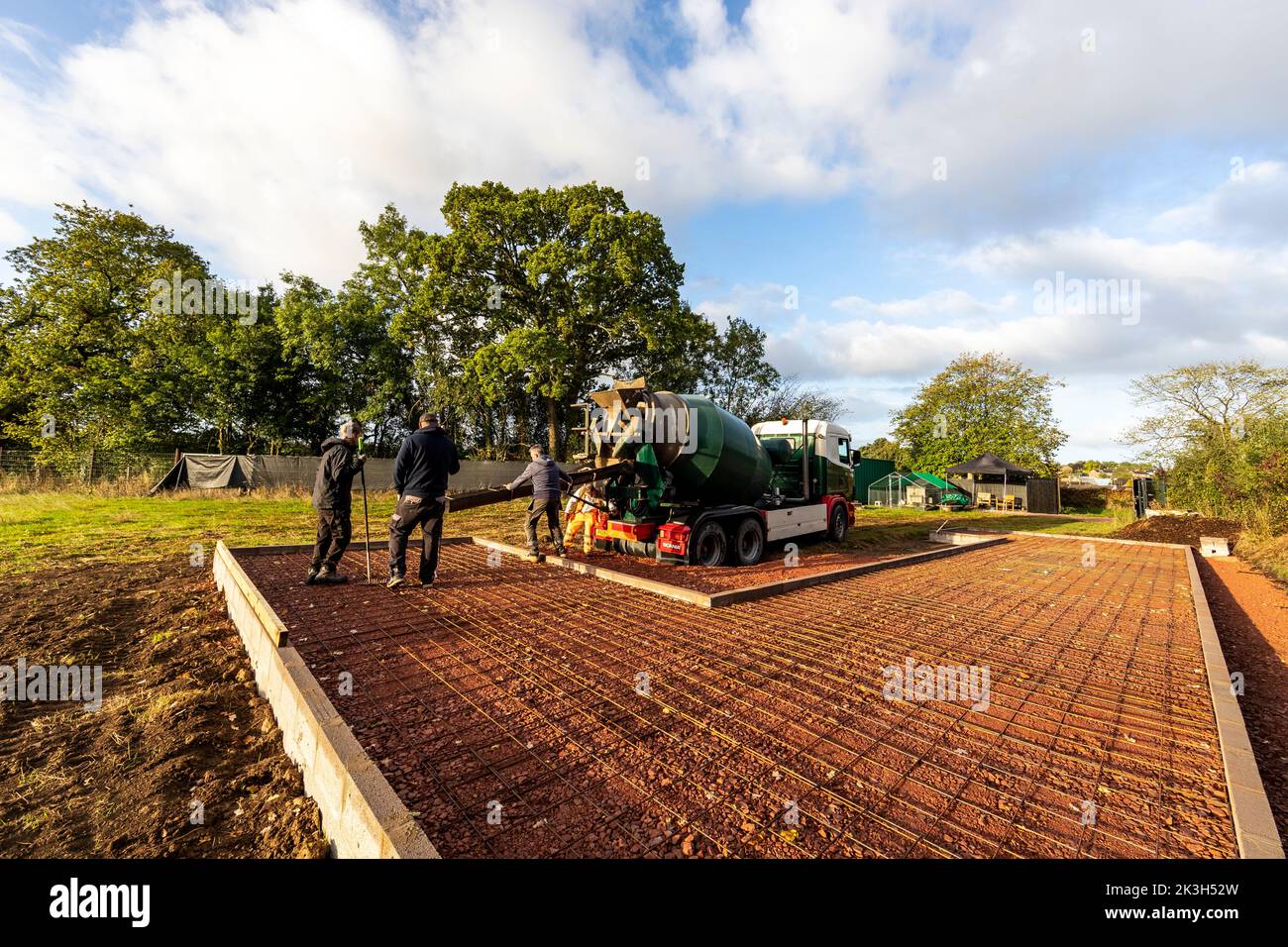Early morning concrete pouring of a stable block slab. Seen as lacking ...