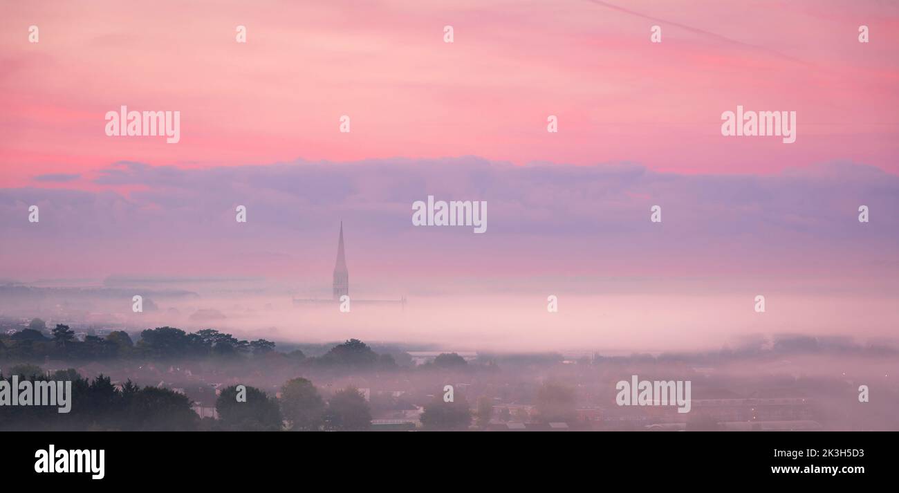 Salisbury Cathedral in the autumn early morning mist from the ramparts ...