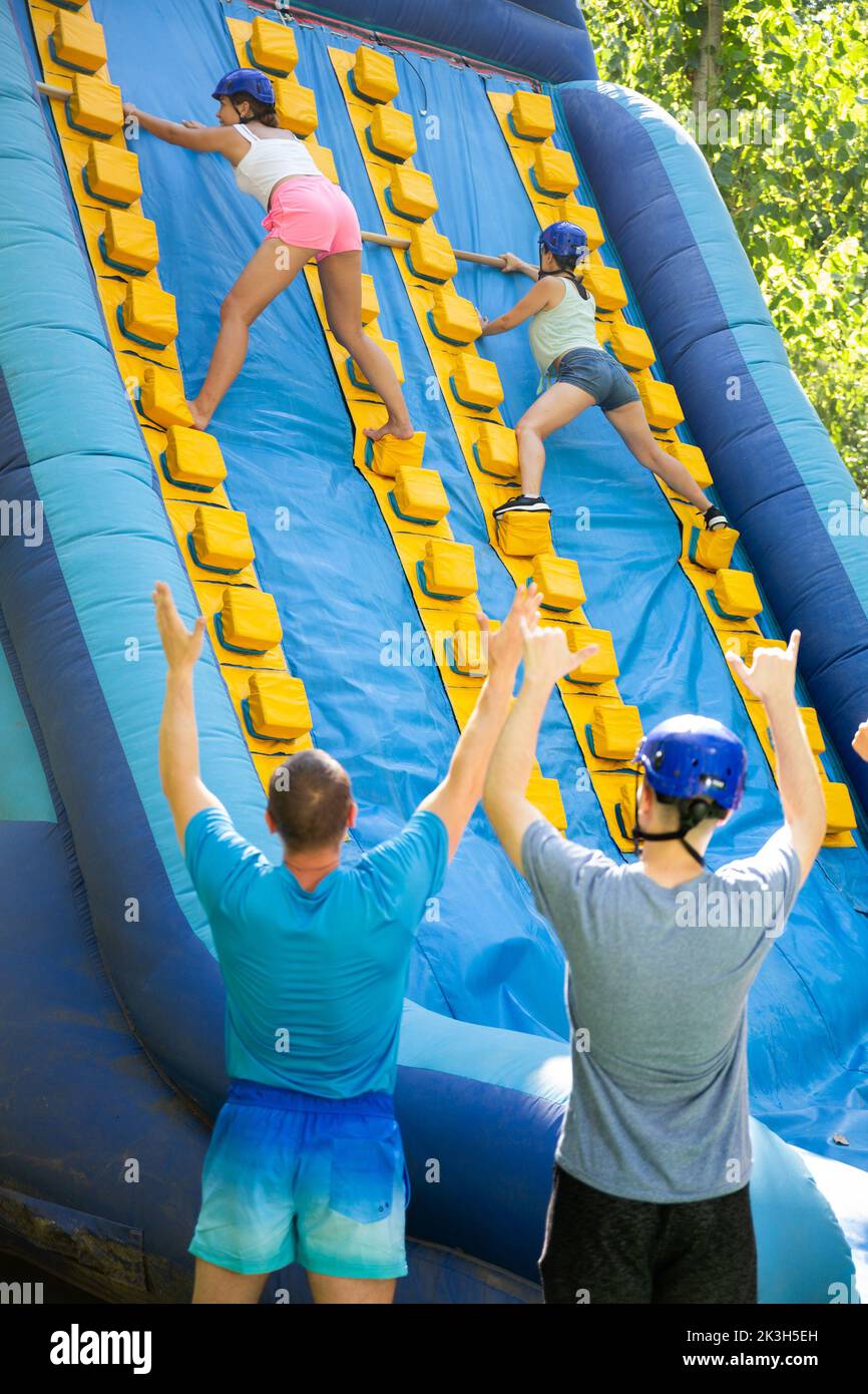 Girl climbing up slide hi-res stock photography and images - Alamy