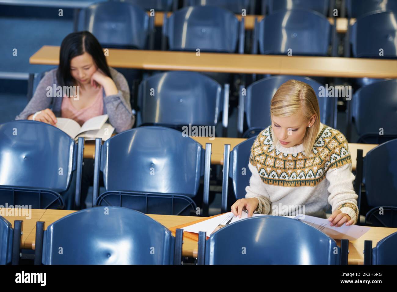 Her education is important to her. A group of students sitting in an ...