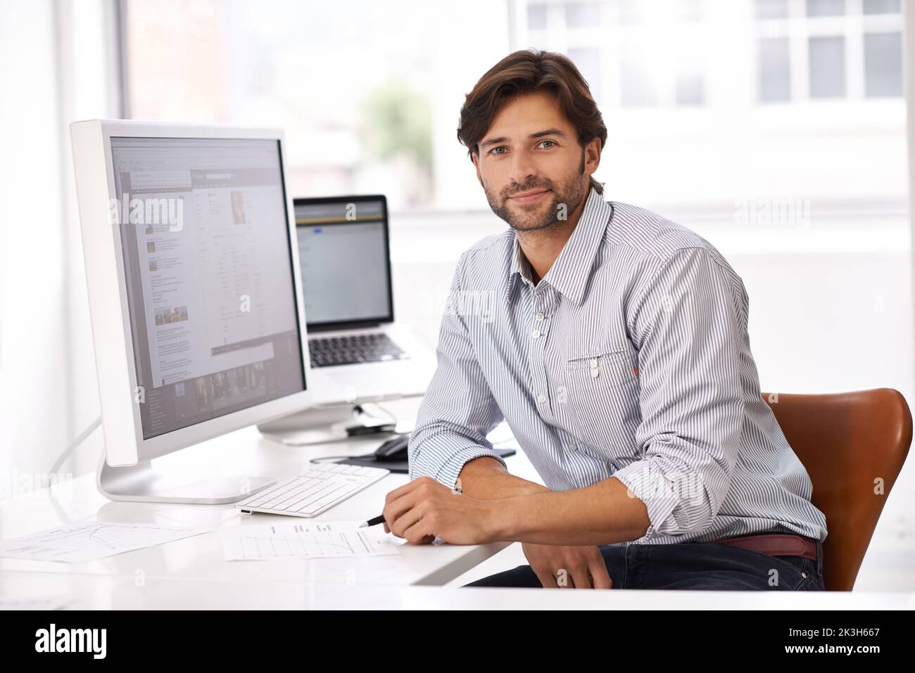 Analyzing data before the big meeting. An attractive businessman going ...