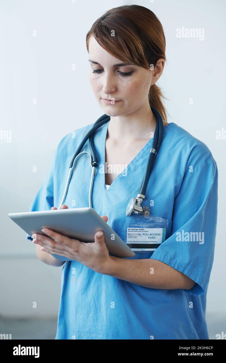 Professional doctor checking medical records hi-res stock photography ...