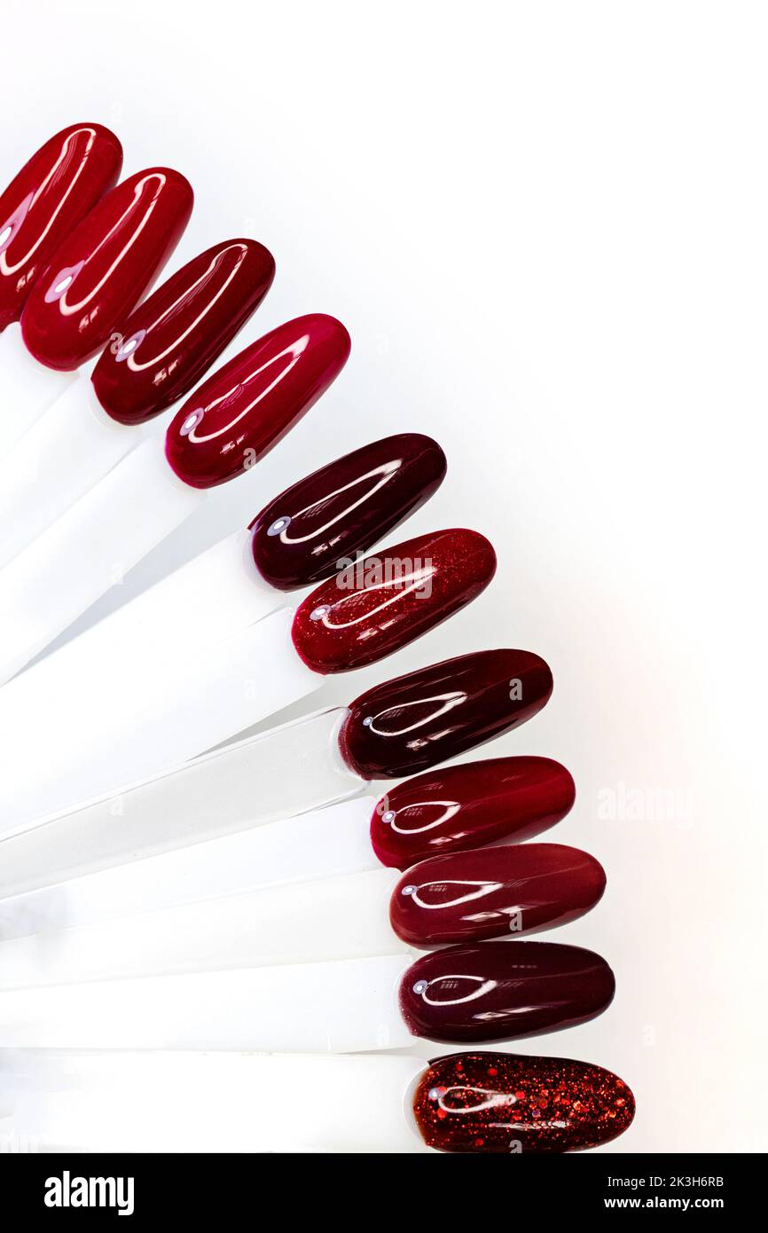 Top view red nails polish palette set for manicure on light background ...