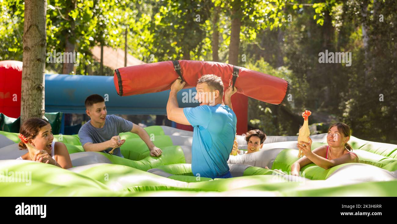 Happy people having fun in amusement park outdoors Stock Photo - Alamy