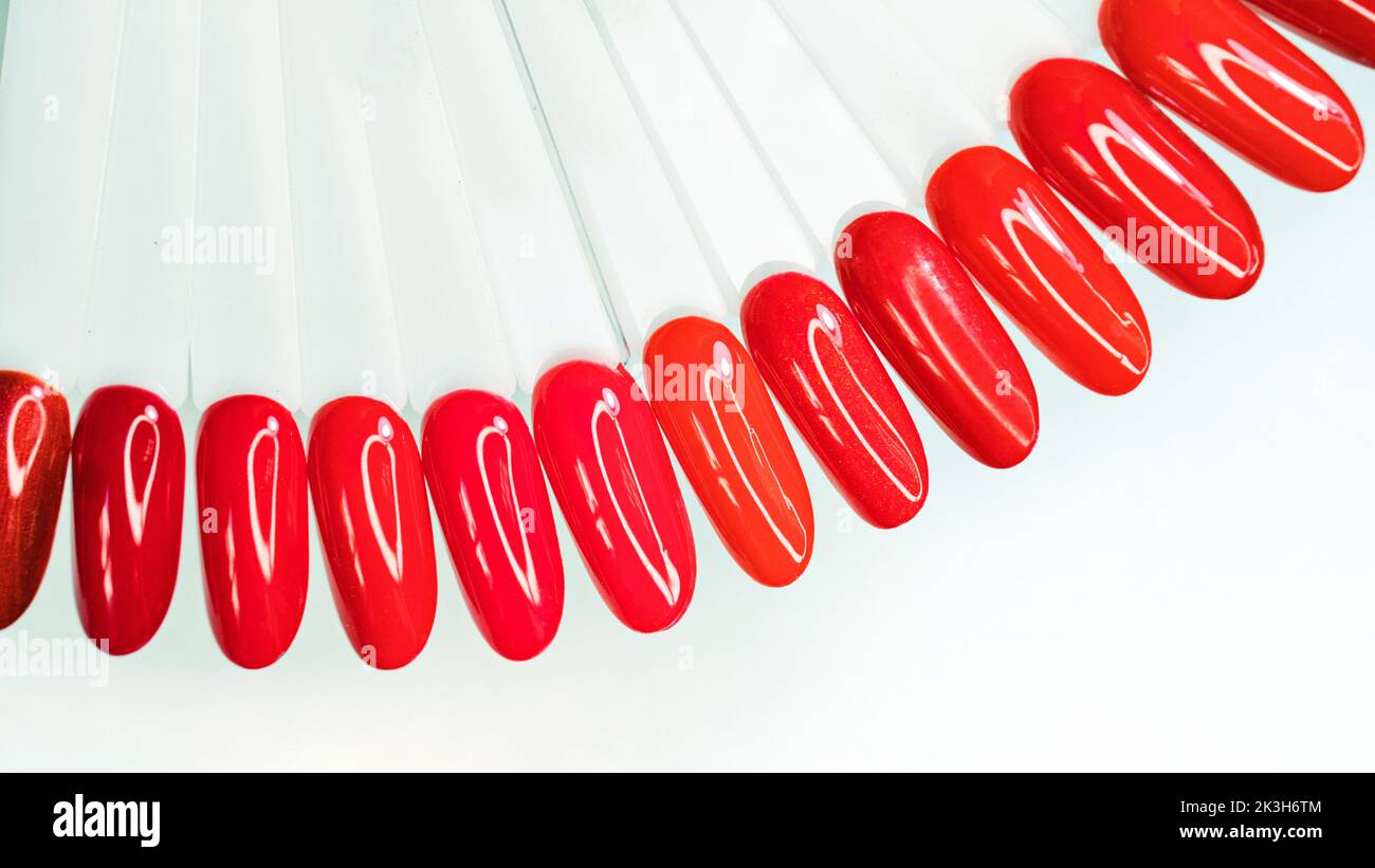 Top view red nails polish palette set for manicure on light background ...